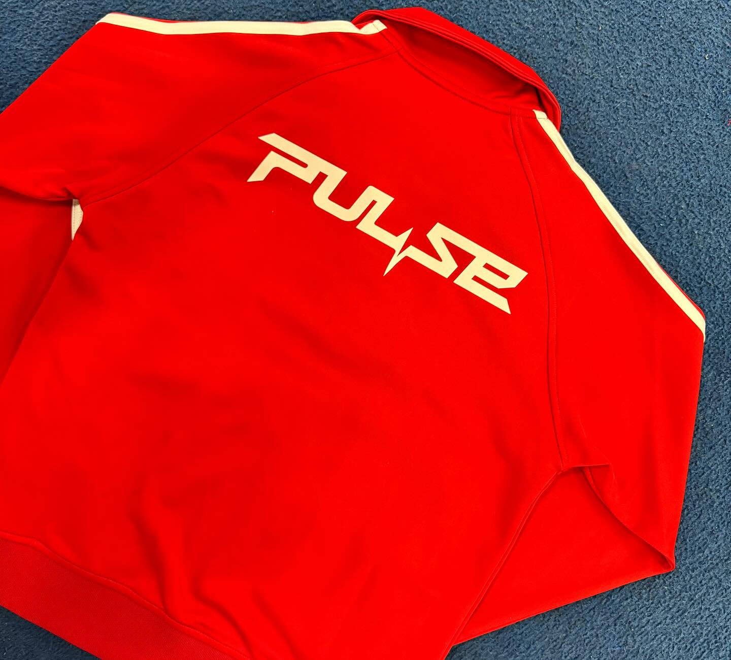 Loving our new Adidas Pulse coach jackets! The red really stands out and will ma…